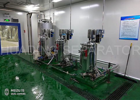 How does a centrifuge separate mixtures?